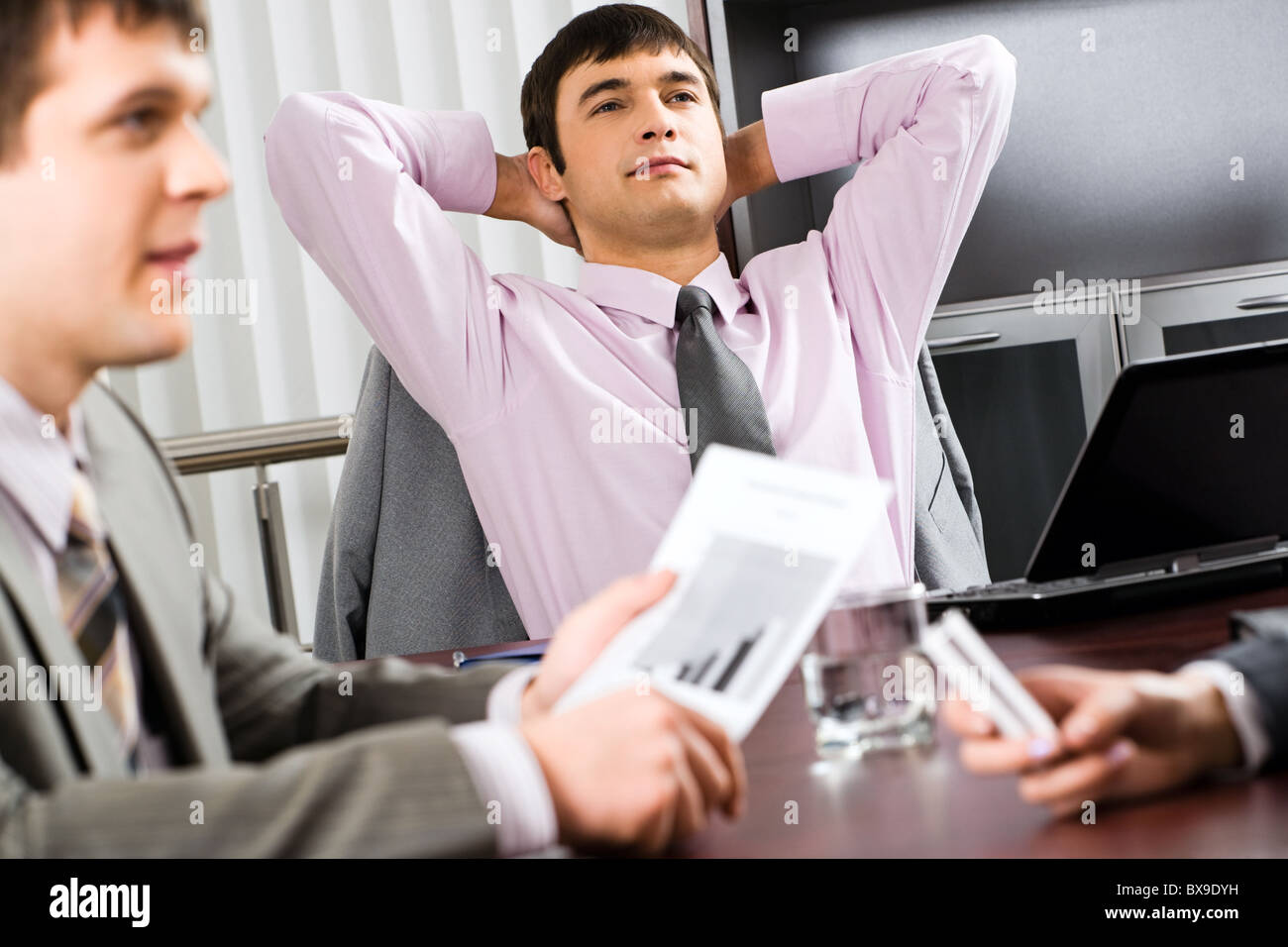 Portrait of successful man having a relax in the office Stock Photo - Alamy