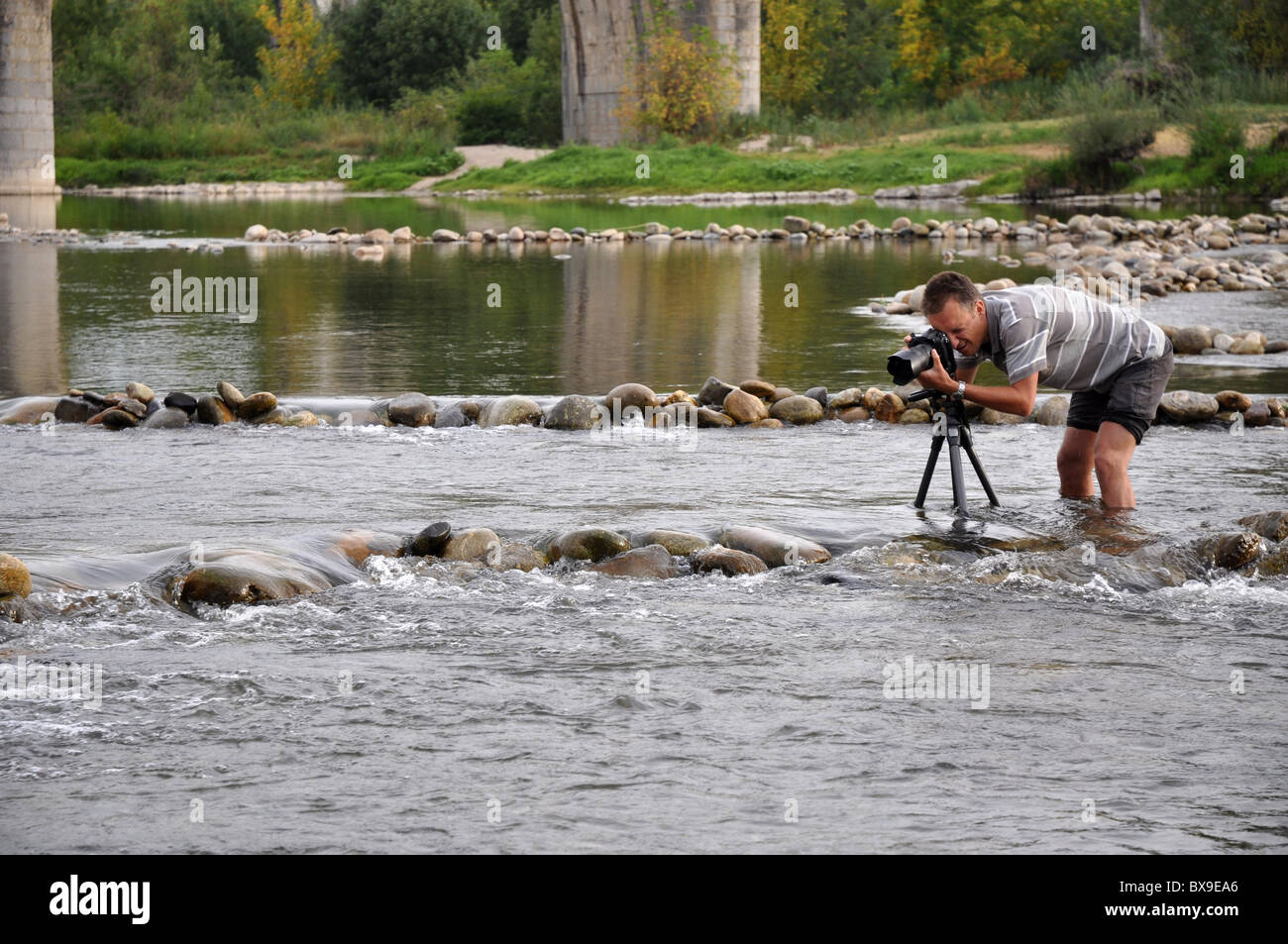 Professional photographer working under difficult circumstances Stock ...