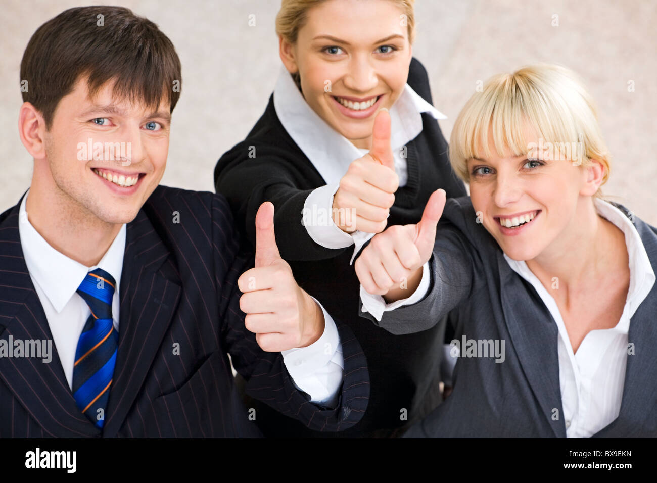 Portrait of three business people showing a sign of okay Stock Photo ...