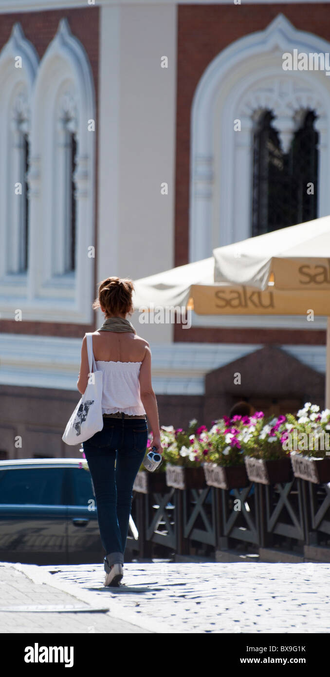 Woman walking down a street in Tallinn, Estonia, Baltic States Stock ...