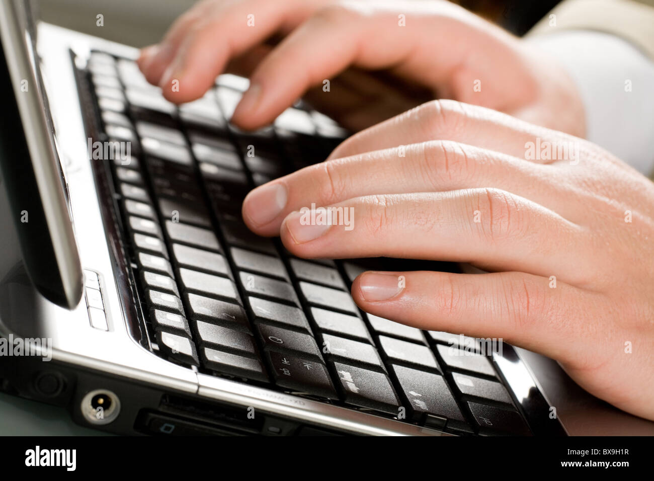 Image of male hands typing a letter on the laptop Stock Photo - Alamy