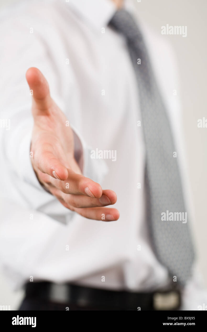 Businessman extending hand hi-res stock photography and images - Alamy