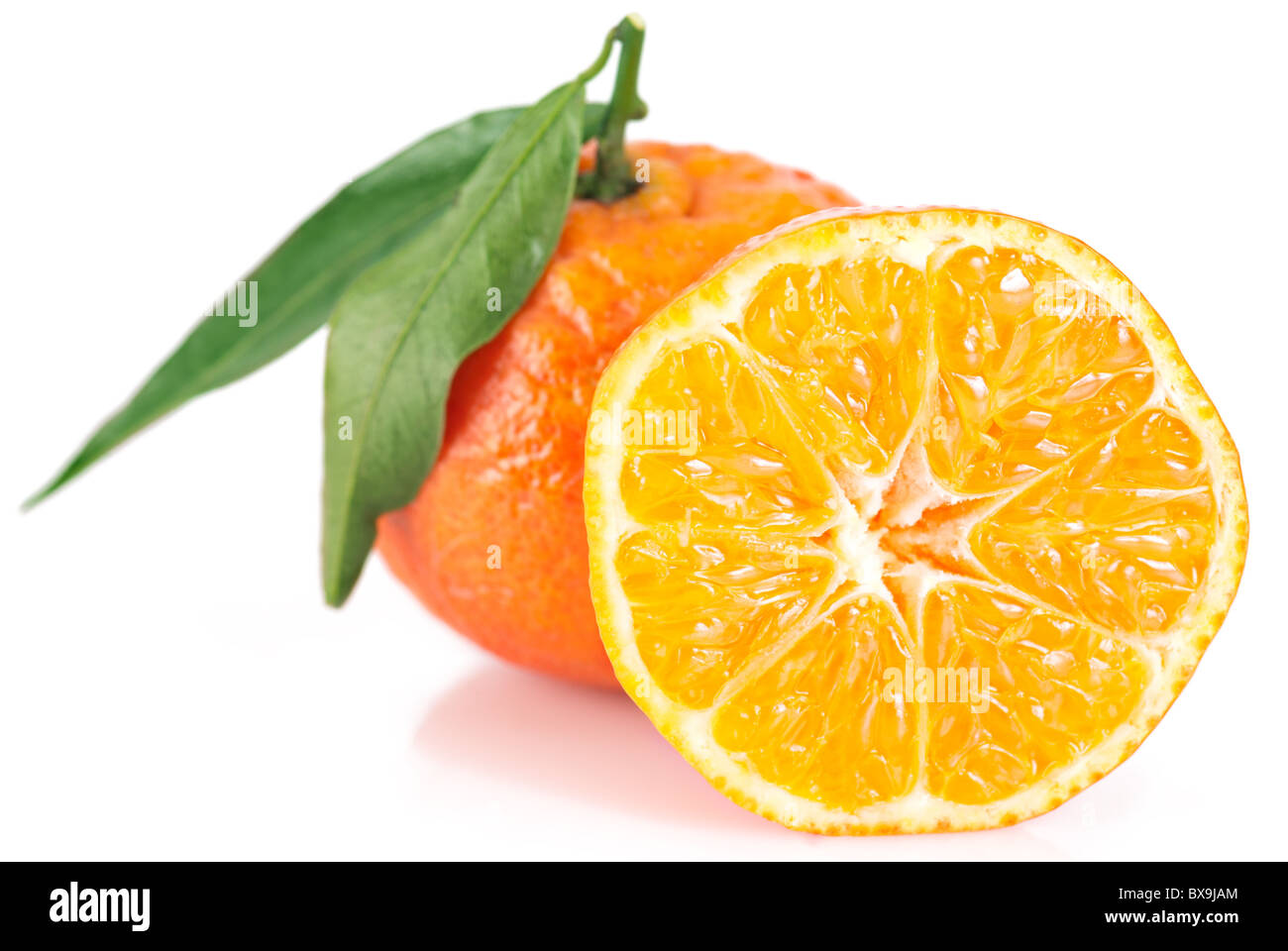 Ripe tangerines with leaves over white background Stock Photo - Alamy