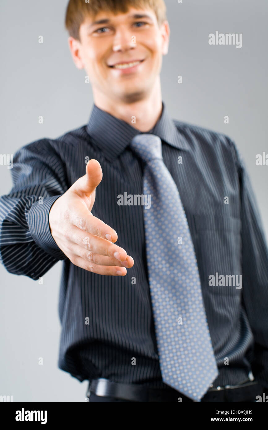 Portrait of businessman giving his hand and saying hallo Stock Photo ...