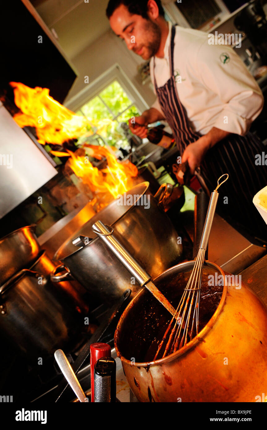 chef in pub kitchen with fire Stock Photo - Alamy