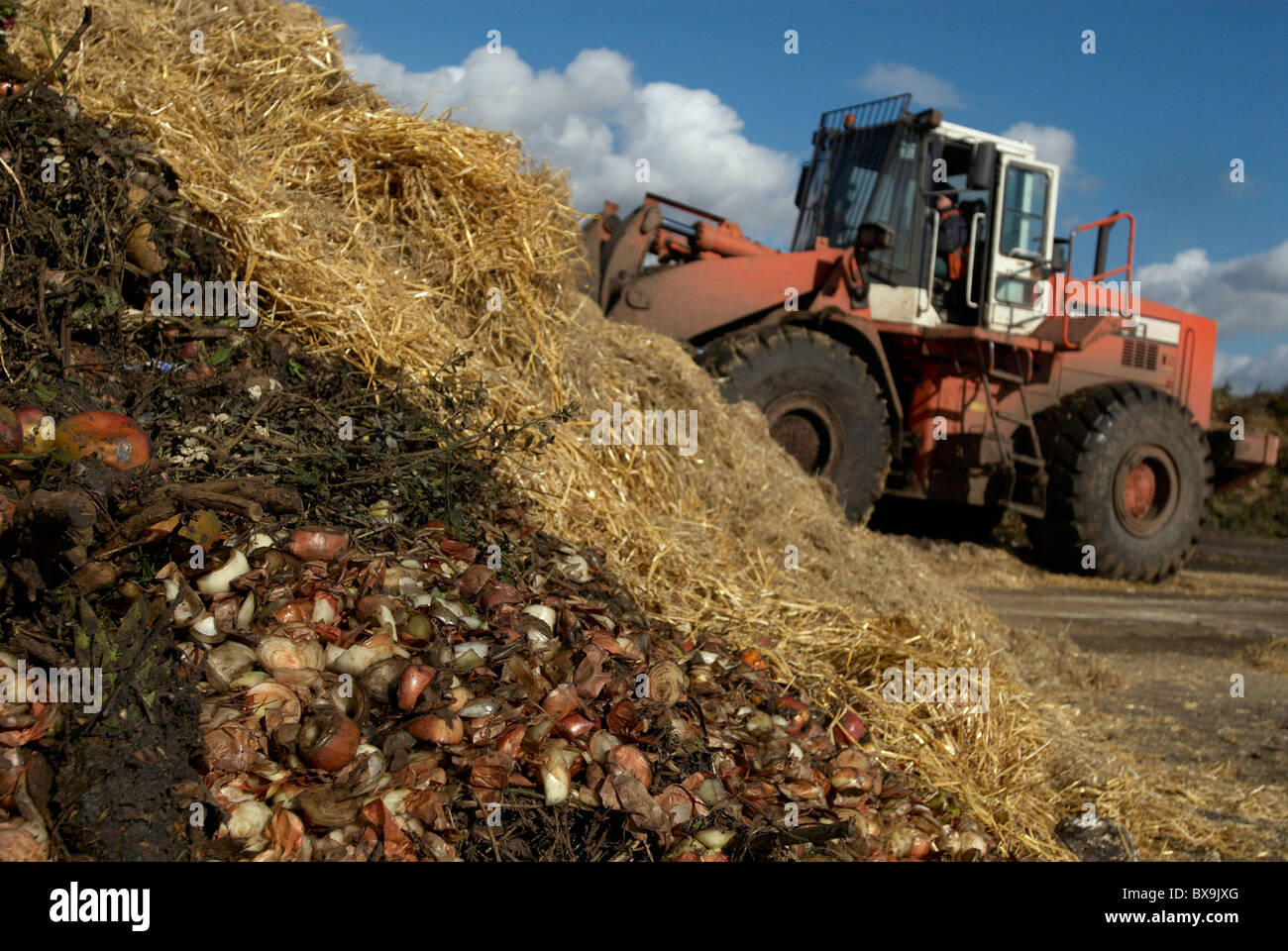 Tractor at site for recycling garden waste Suffolk UK Stock Photo - Alamy