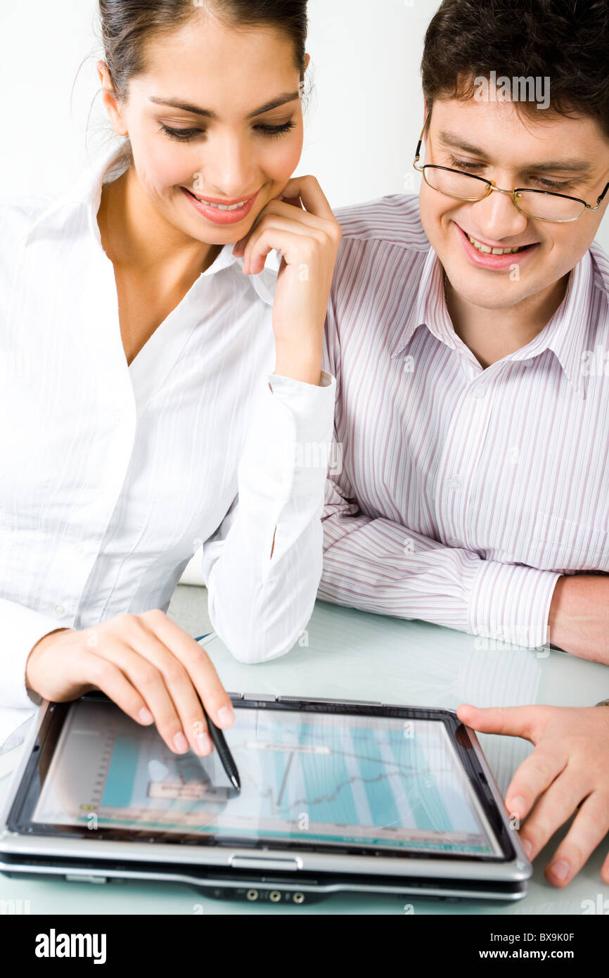 Portrait of business woman and man reading a text on workplace Stock ...