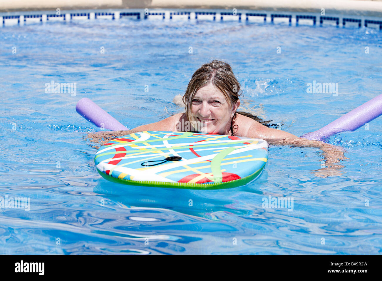 Senior Lady (60s) Learning to Swim Stock Photo - Alamy