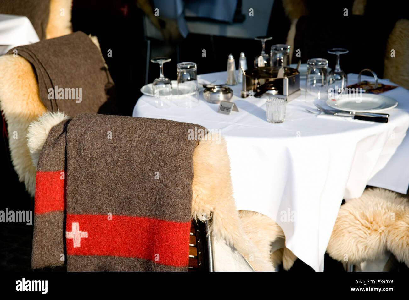 With tableware covered restaurant table with swiss army blankets and ...