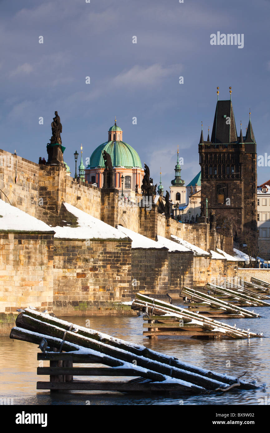 Famous Charles bridge on Vltava river in Prague in winter Stock Photo ...