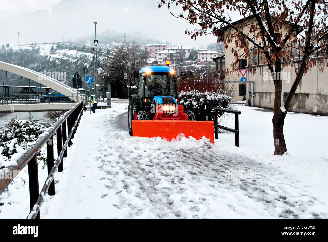 bulldozer shoveling snow in the Italian streets Stock Photo - Alamy