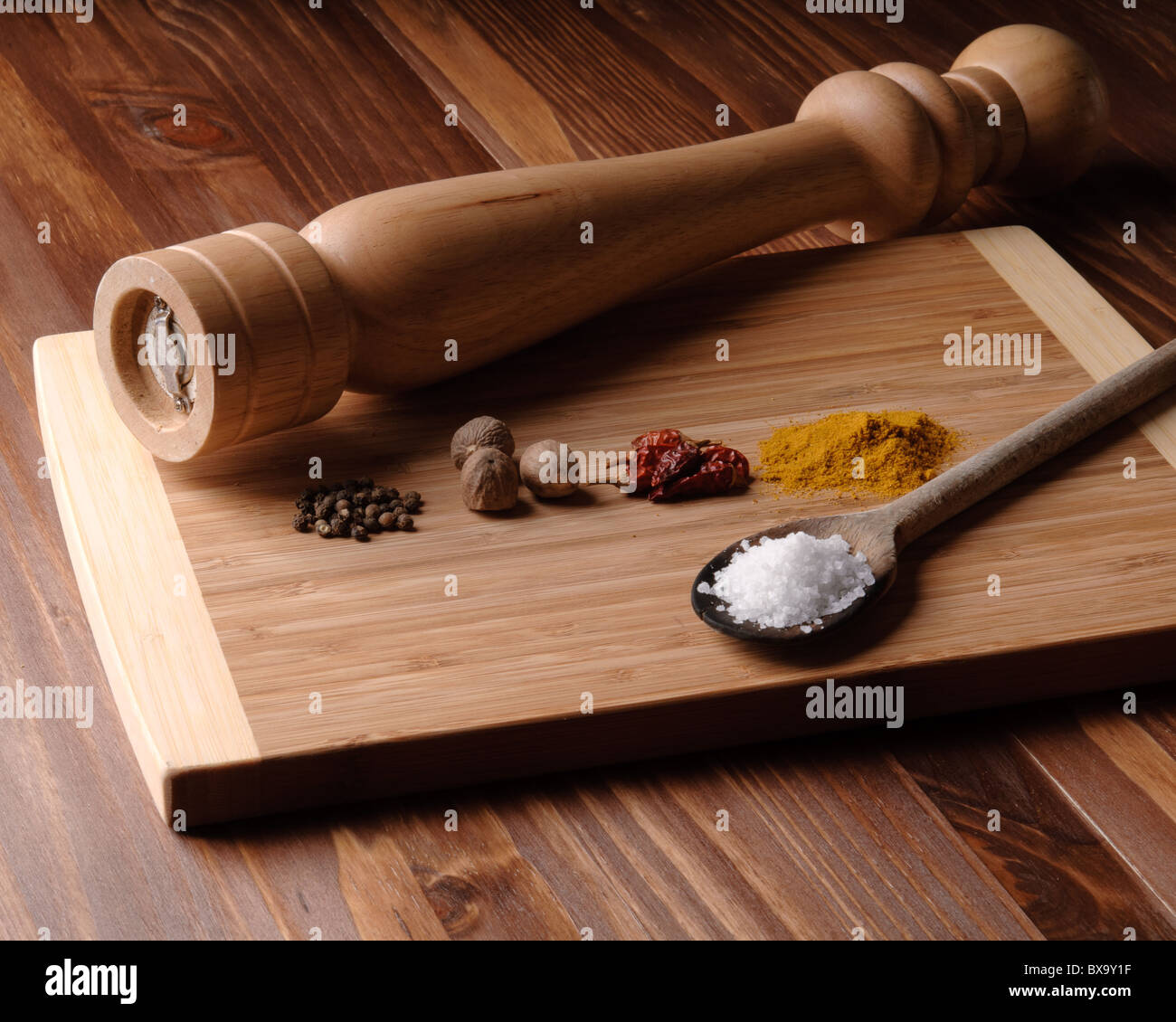 colorful spices on chopping board Stock Photo - Alamy
