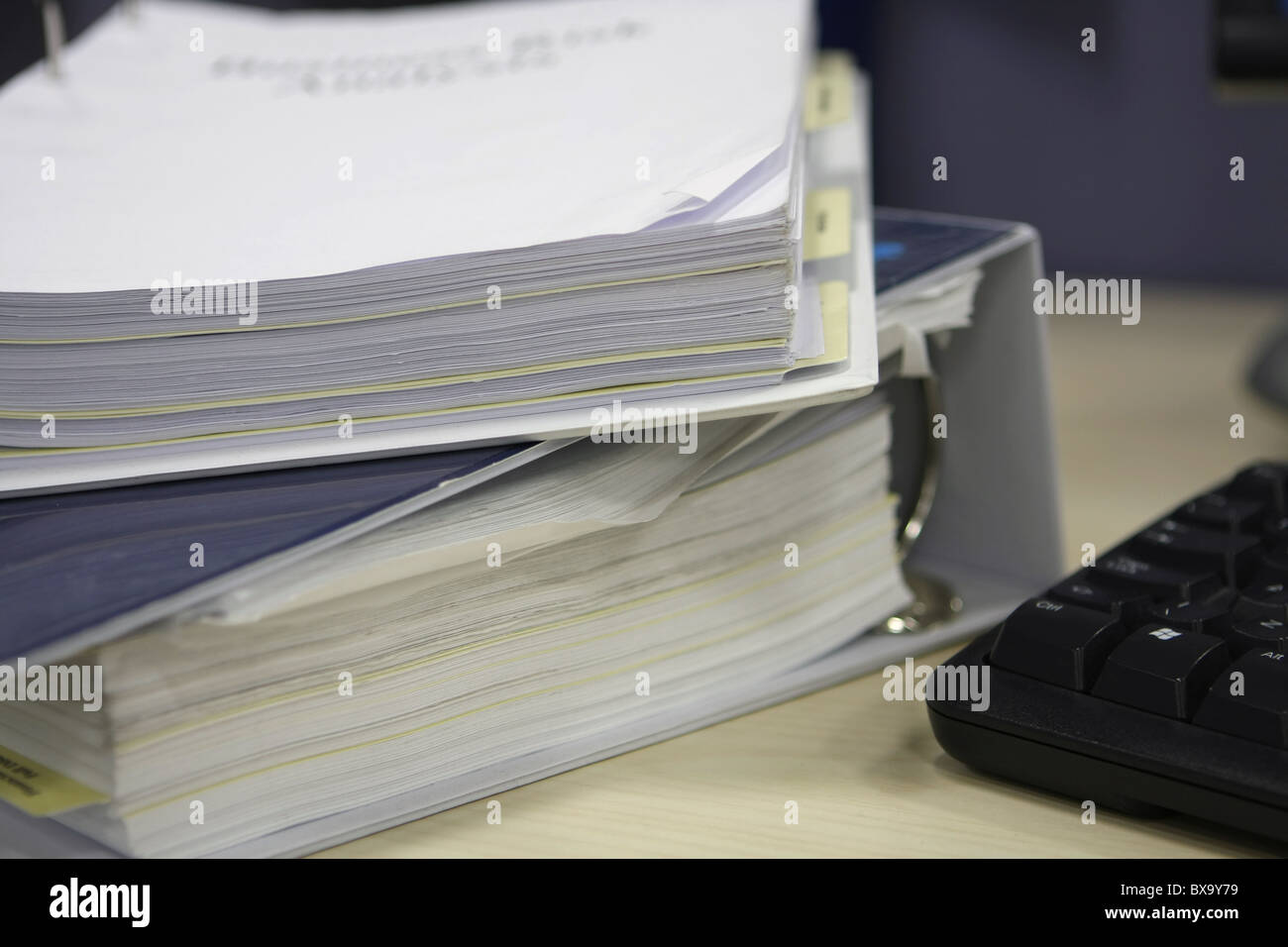 A4 folders full of papers next to part of a computer keyboard Stock ...