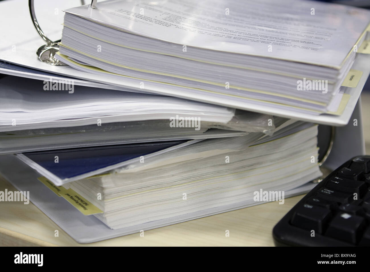 A4 folders full of papers next to part of a computer keyboard Stock ...