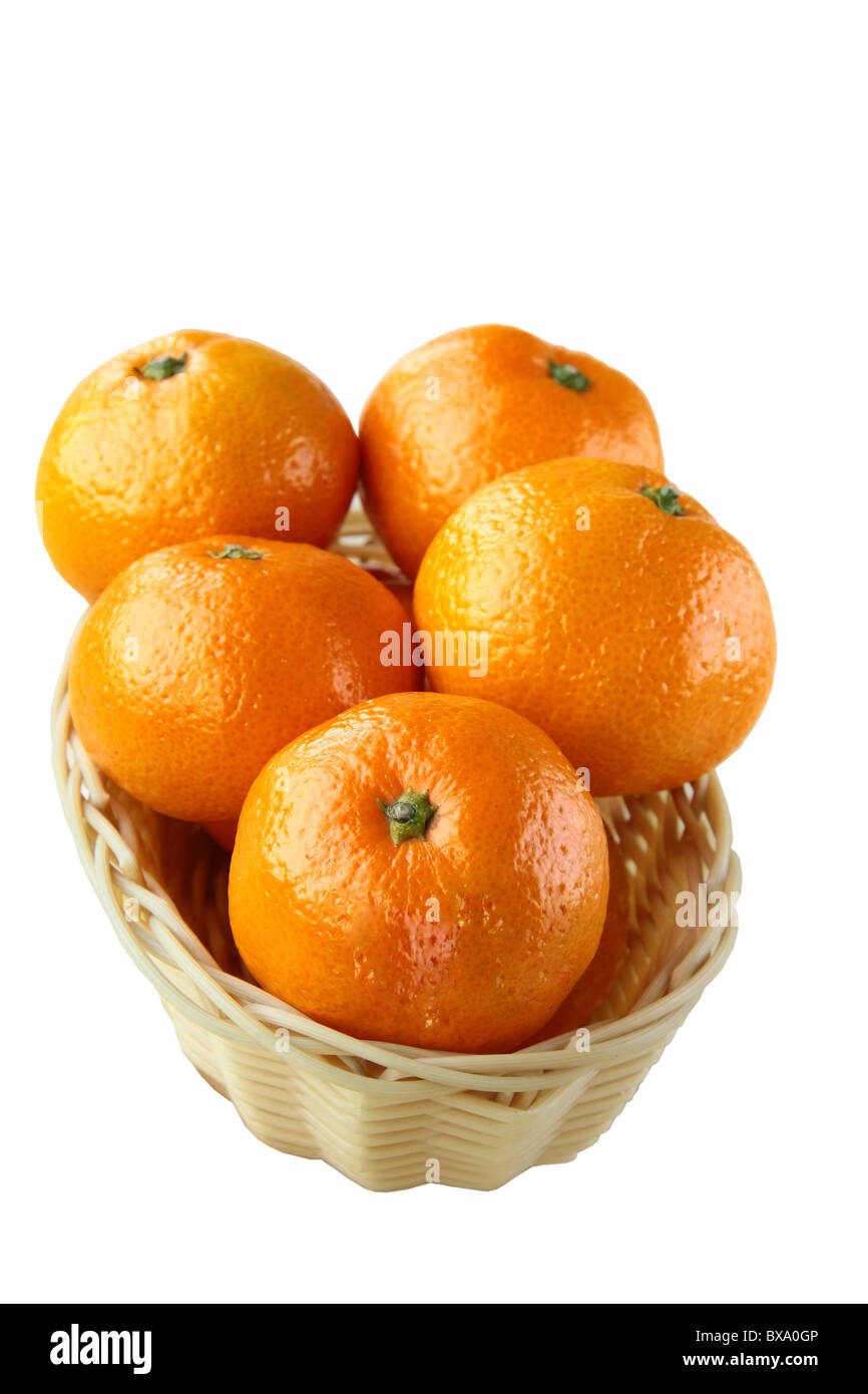 Fresh mandarin orange in a basket isolated on white Stock Photo - Alamy
