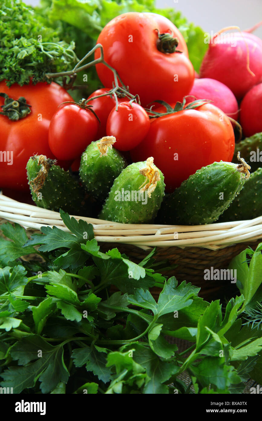 Fresh vegetables and herbs mix in a wicker basket Stock Photo - Alamy