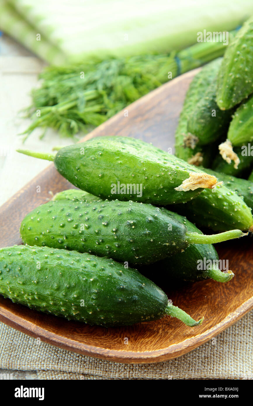 Fresh cucumber on a stylish wooden plate Stock Photo - Alamy