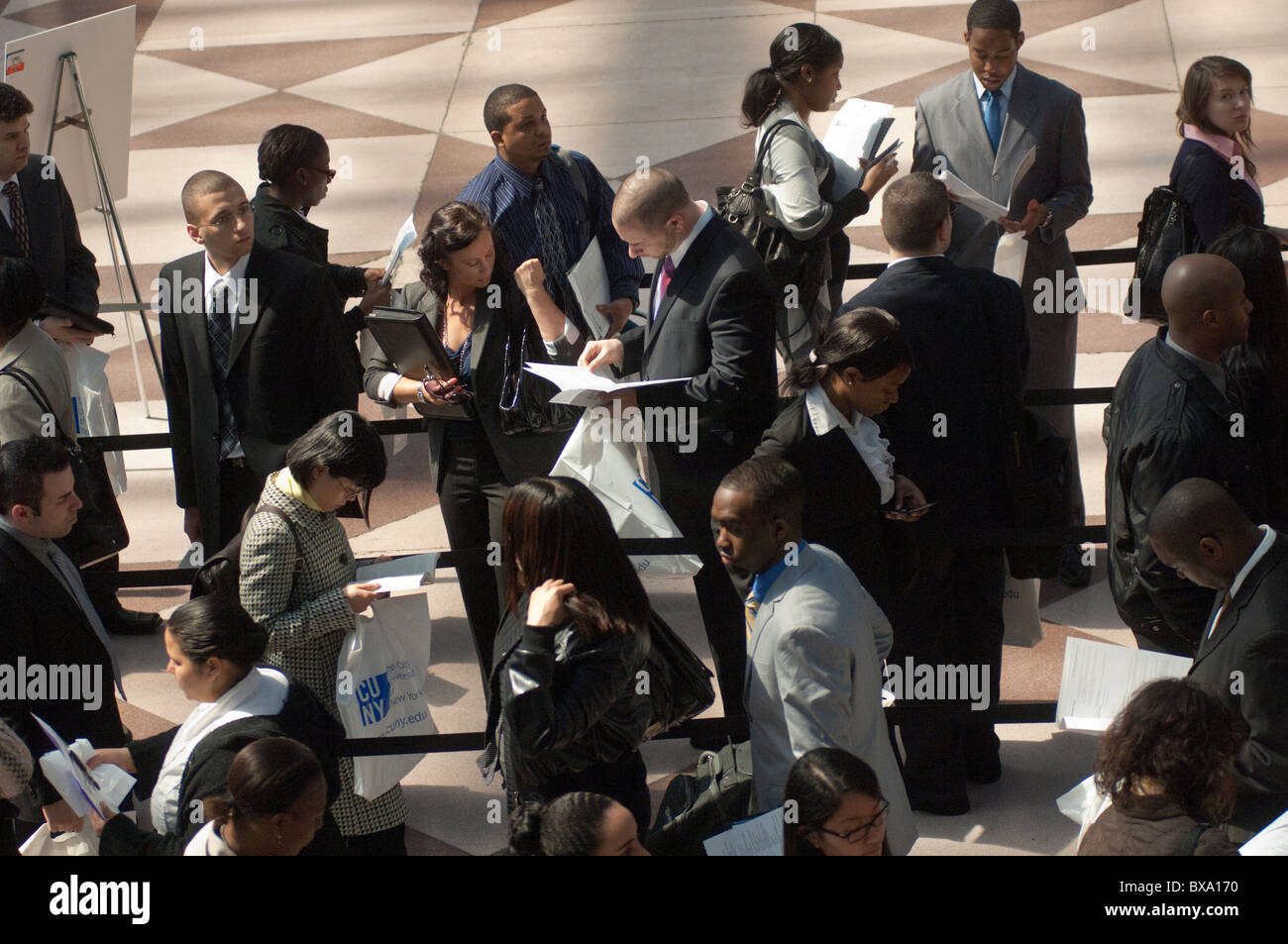 Job seekers attend the CUNY Big Apple Job Fair at the Jacob Javits ...