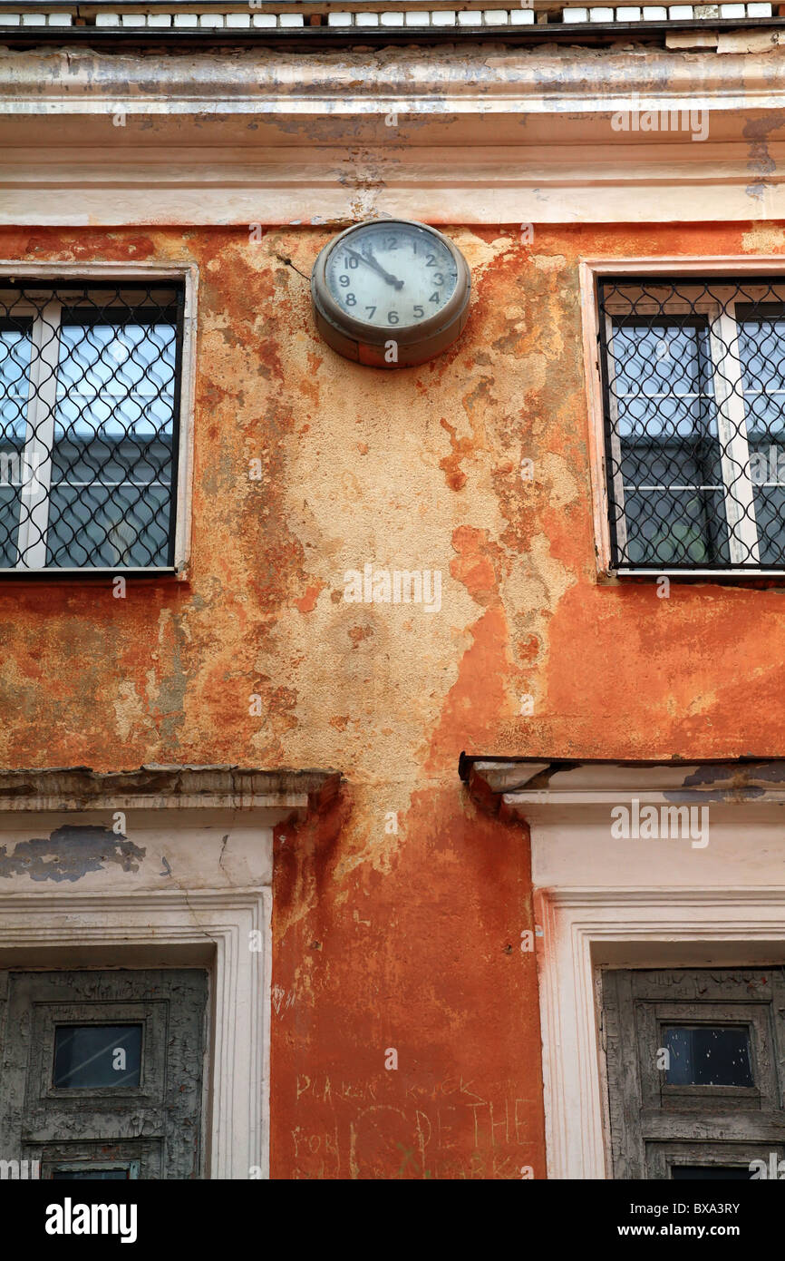 watch on wall of the old building Stock Photo - Alamy