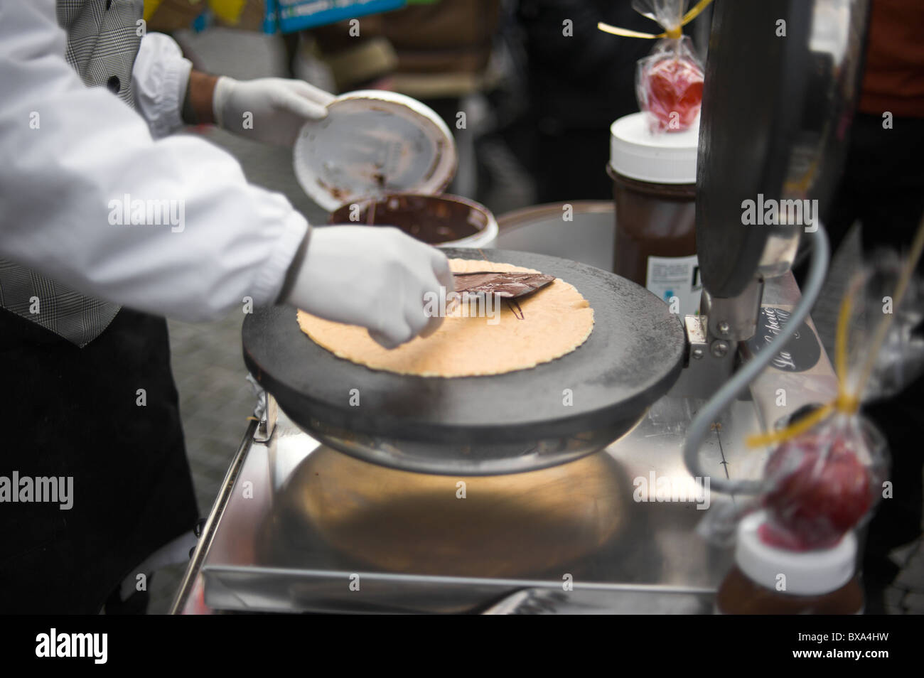 Rome, piazza Navona, man preparing crepes with chocolate spread ...