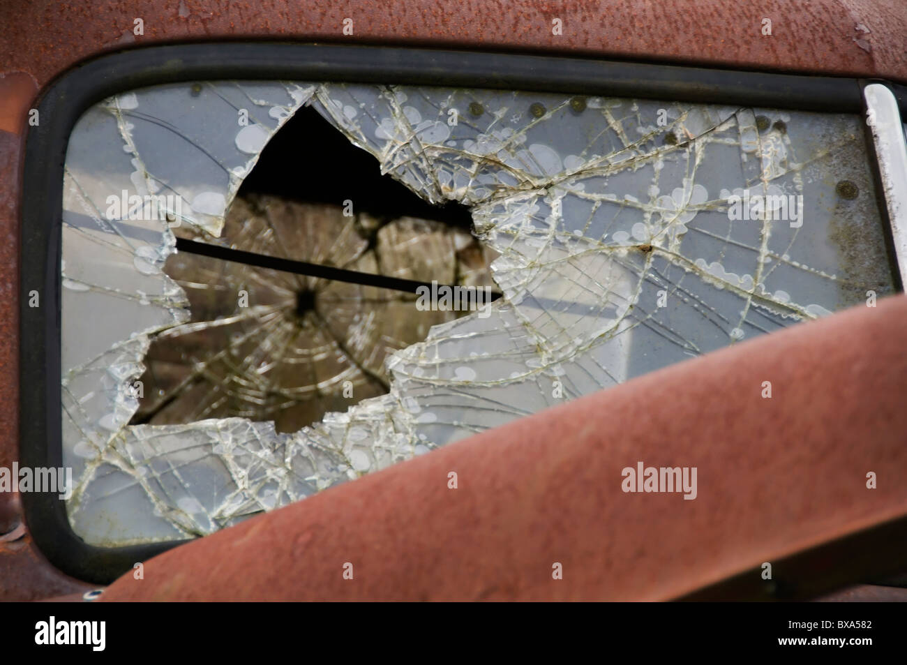 Close-up view of shattered windshield on rusty old truck Stock Photo ...