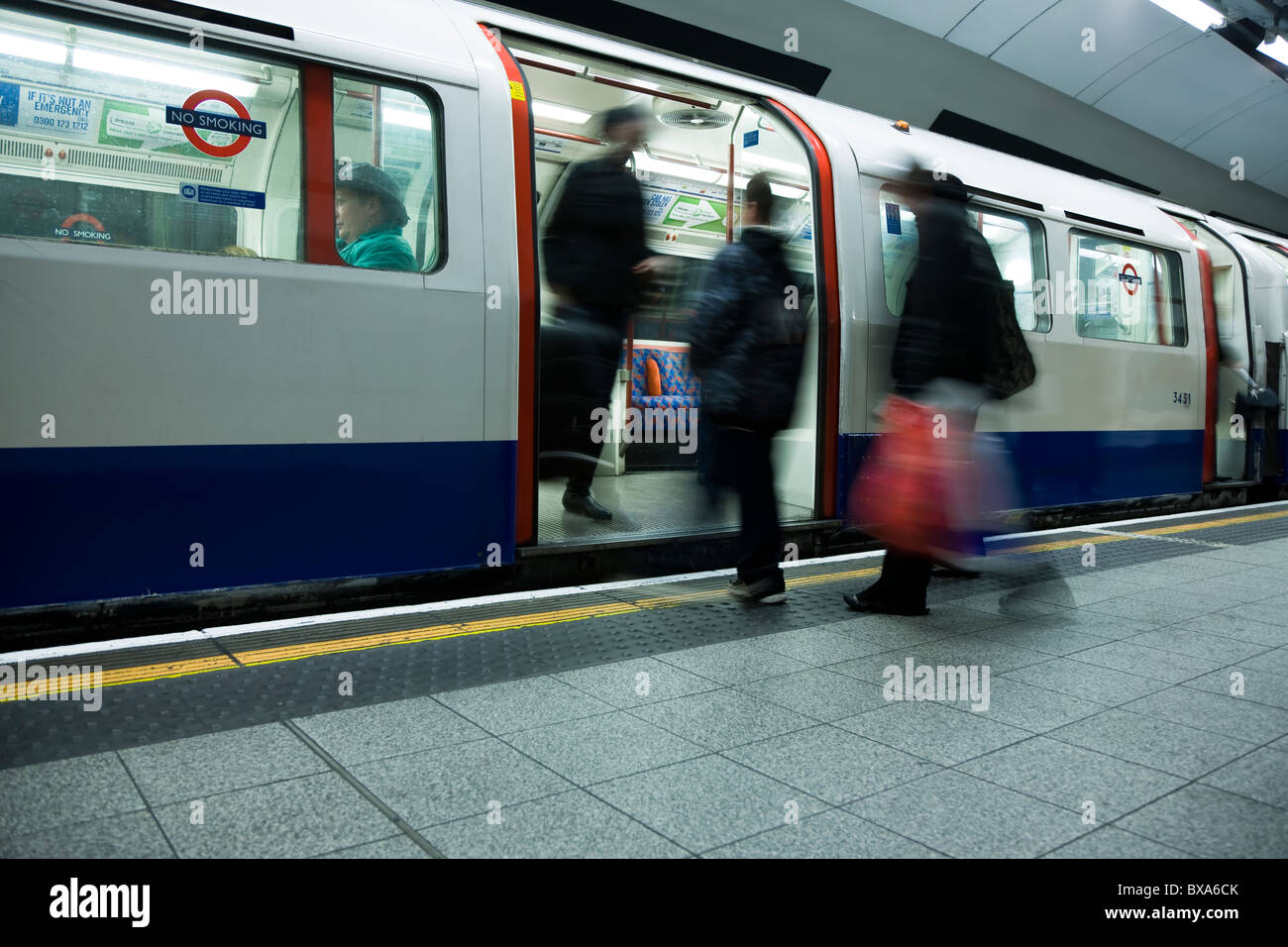 Passengers getting on subway train in London, UK Stock Photo - Alamy