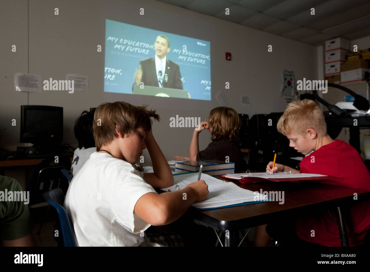 Students in 6th-grade social studies class take notes while watching U ...