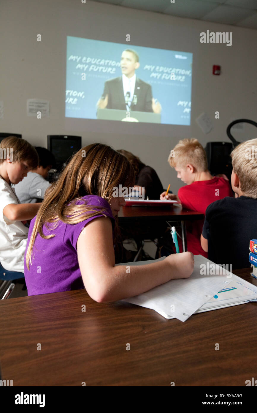 Students in 6th-grade social studies class take notes while watching U ...