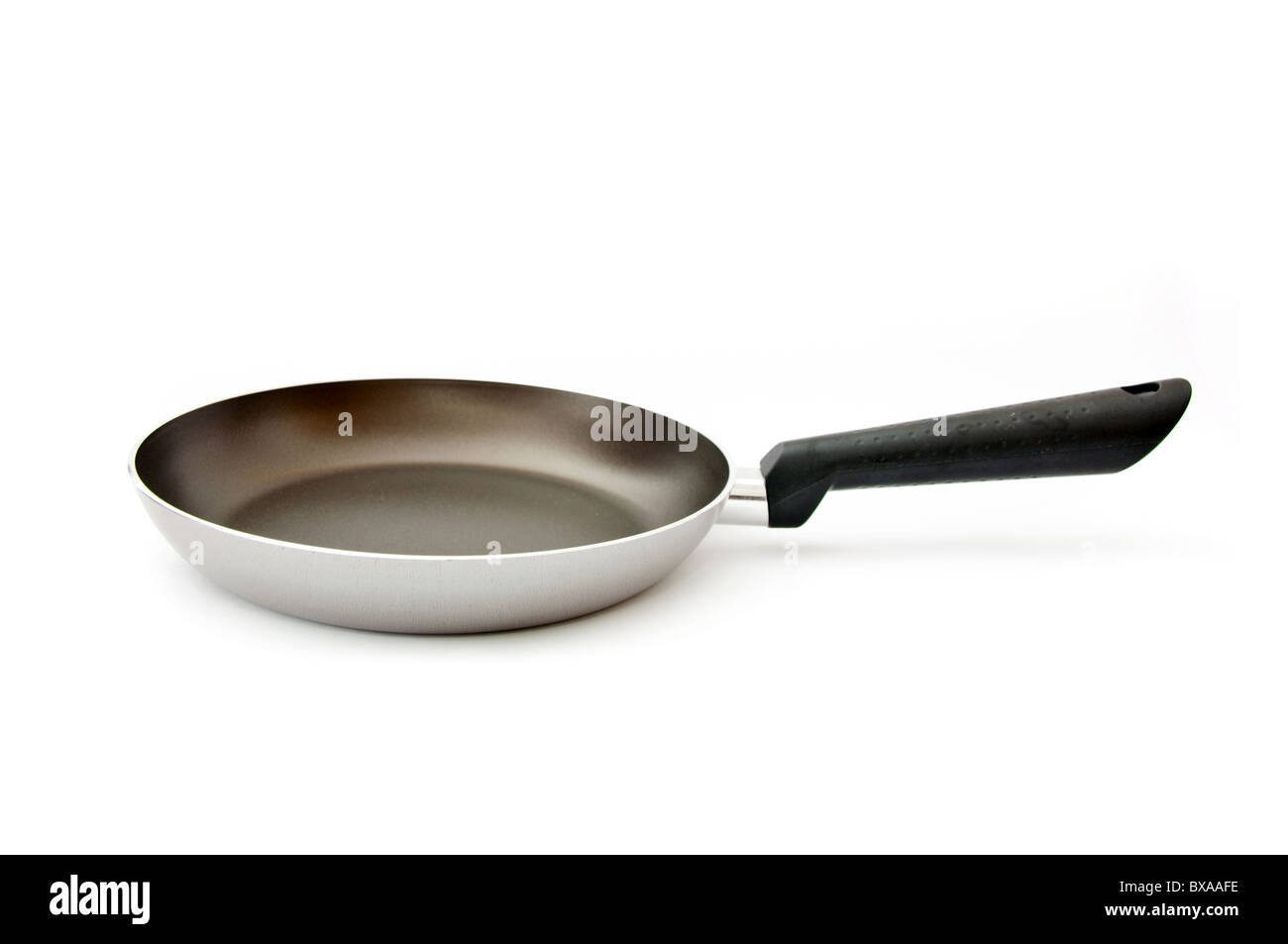 Large metal frying pan, image is taken over a white background Stock ...