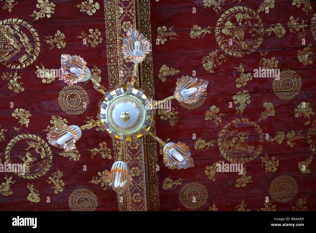 An elaborate chandelier hangs in a temple in Luang Prabang Stock Photo ...