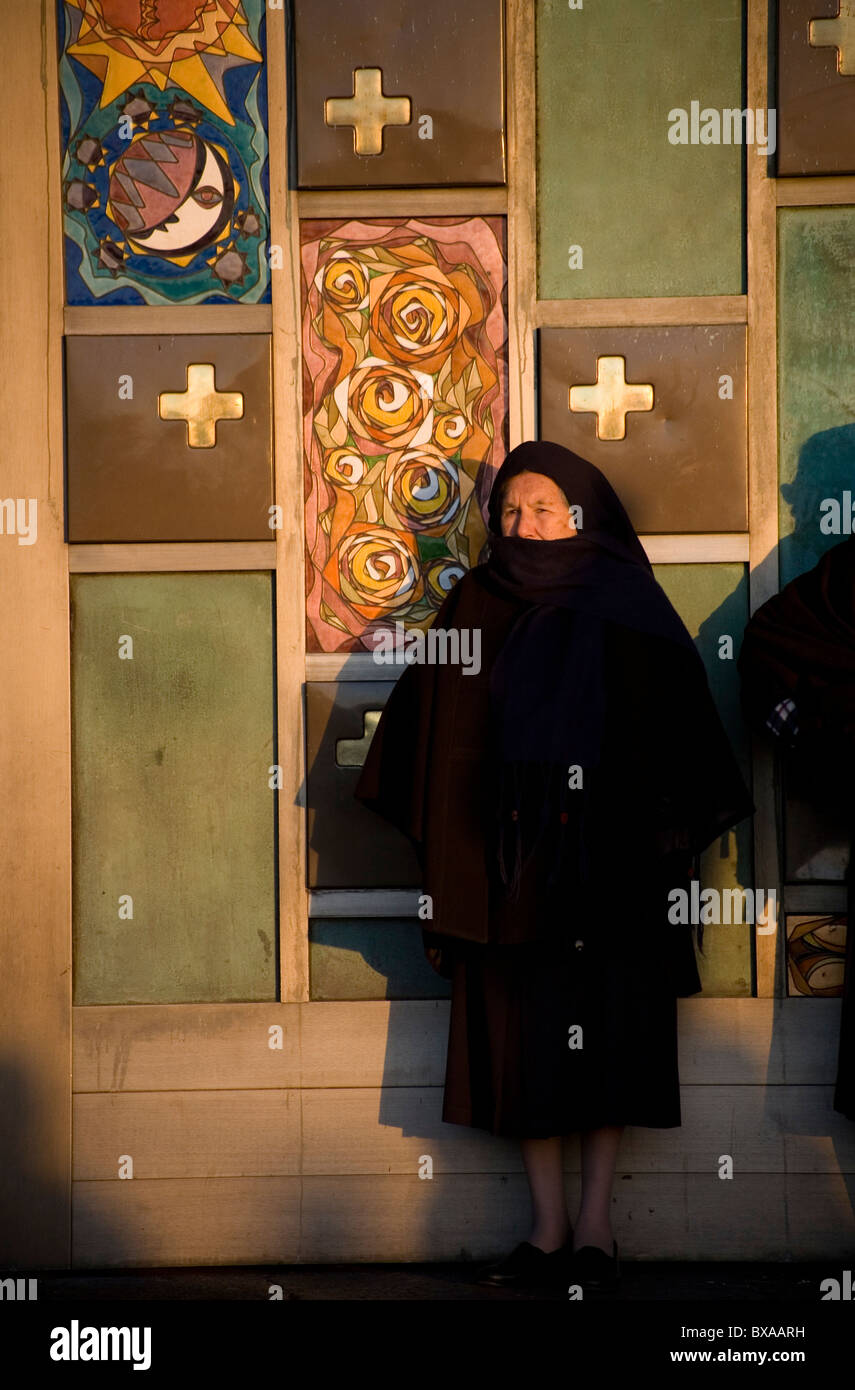 A nun stands at the entrance of the Our Lady of Guadalupe Basilica in ...