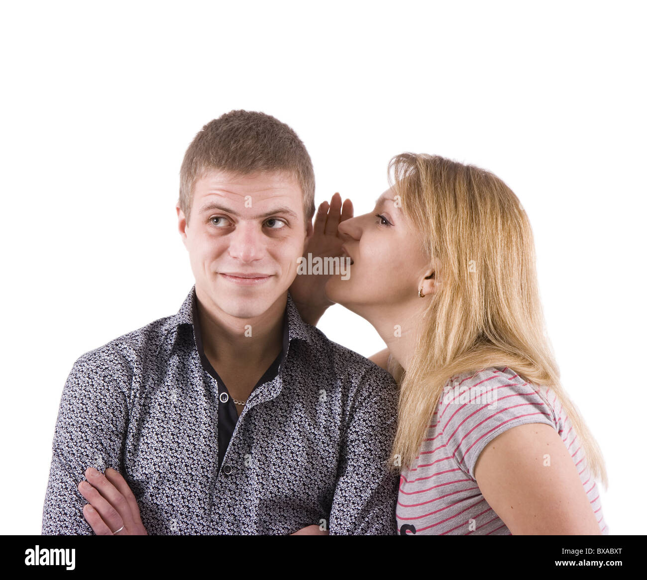 The girl silently tells something to the young man Stock Photo - Alamy