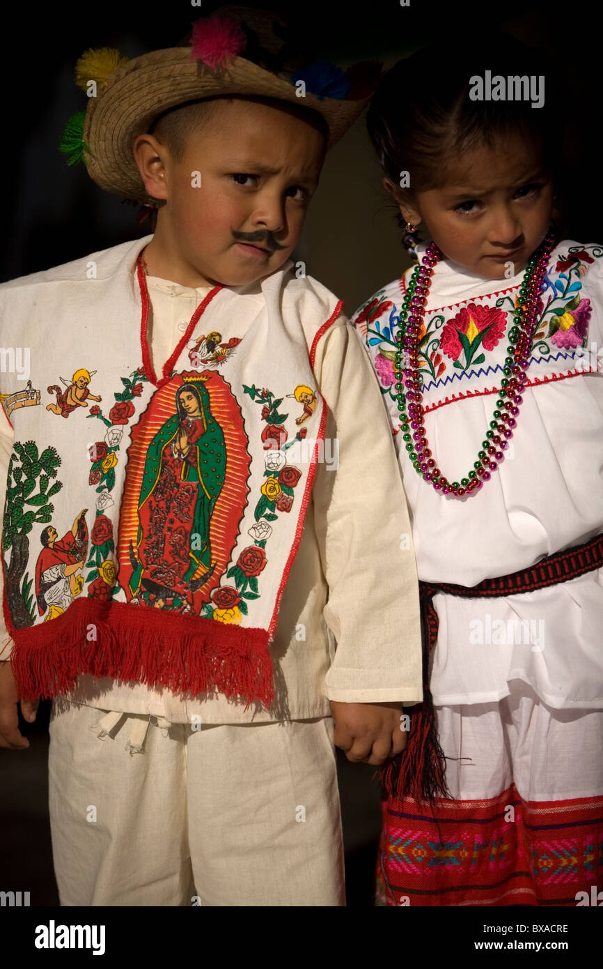 Children dressing traditional indigenous costumes pose in the Our Lady ...