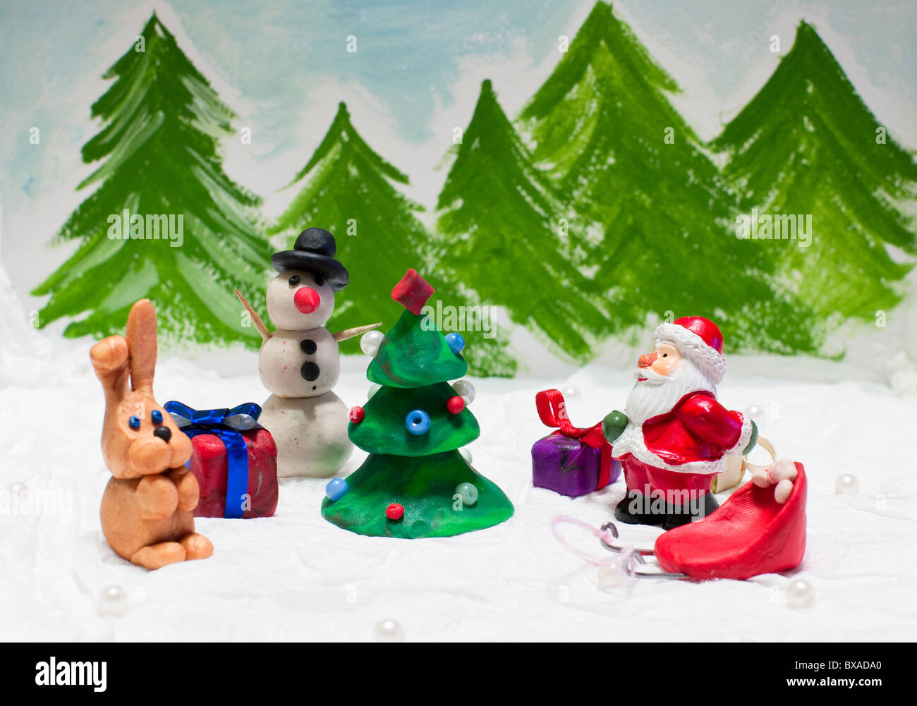 Christmas scene with Santa Claus, snowmen, bunny, Christmas tree and ...