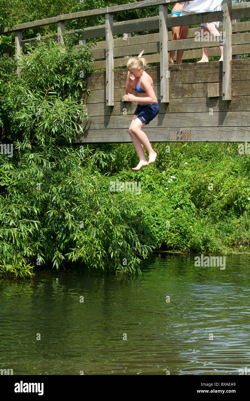 Kids larking about in a river Stock Photo - Alamy
