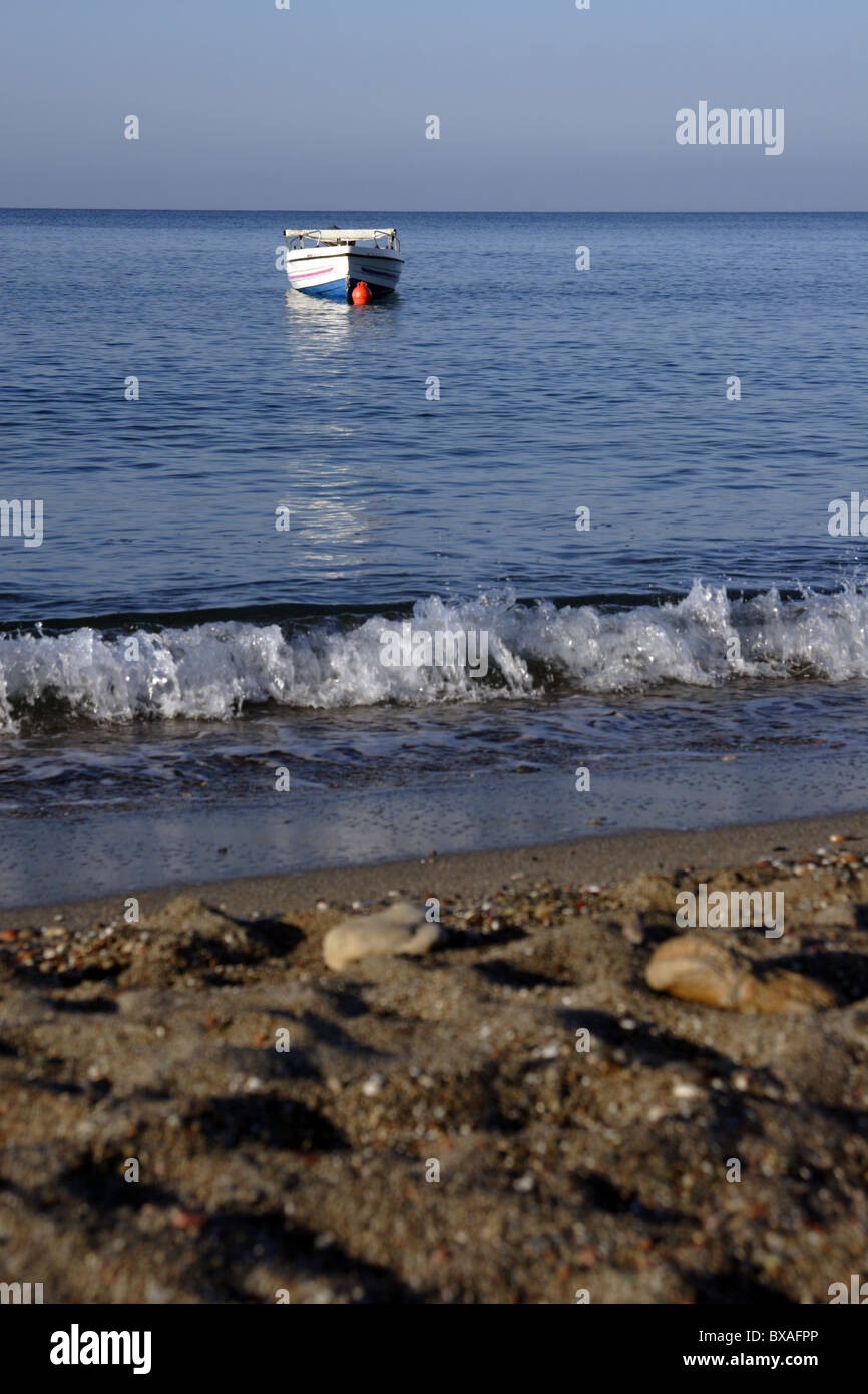 Small boat moored off shore, Lothiarika, near Lardos, Rhodes, Greece ...