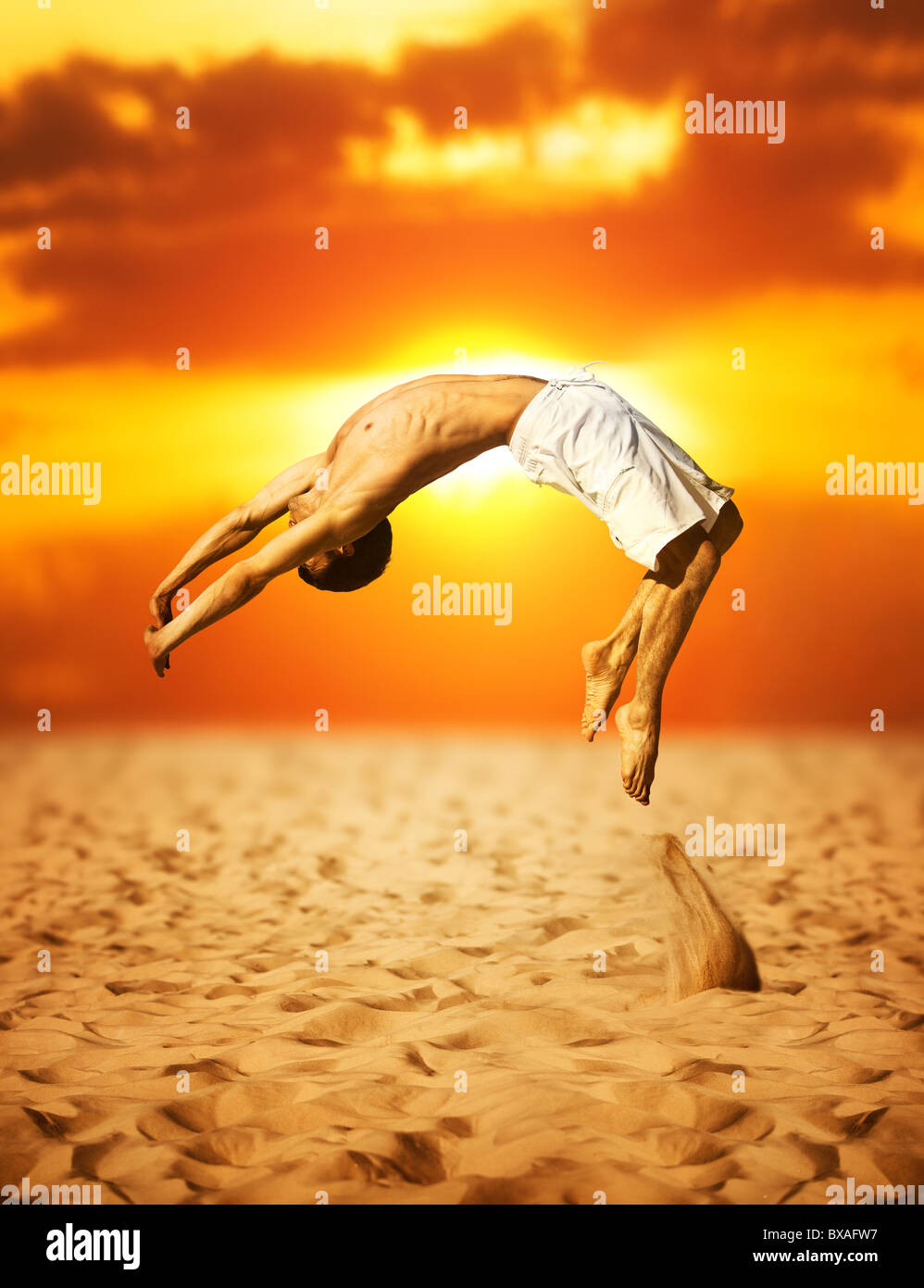 Young man jumping. On sunset background Stock Photo - Alamy