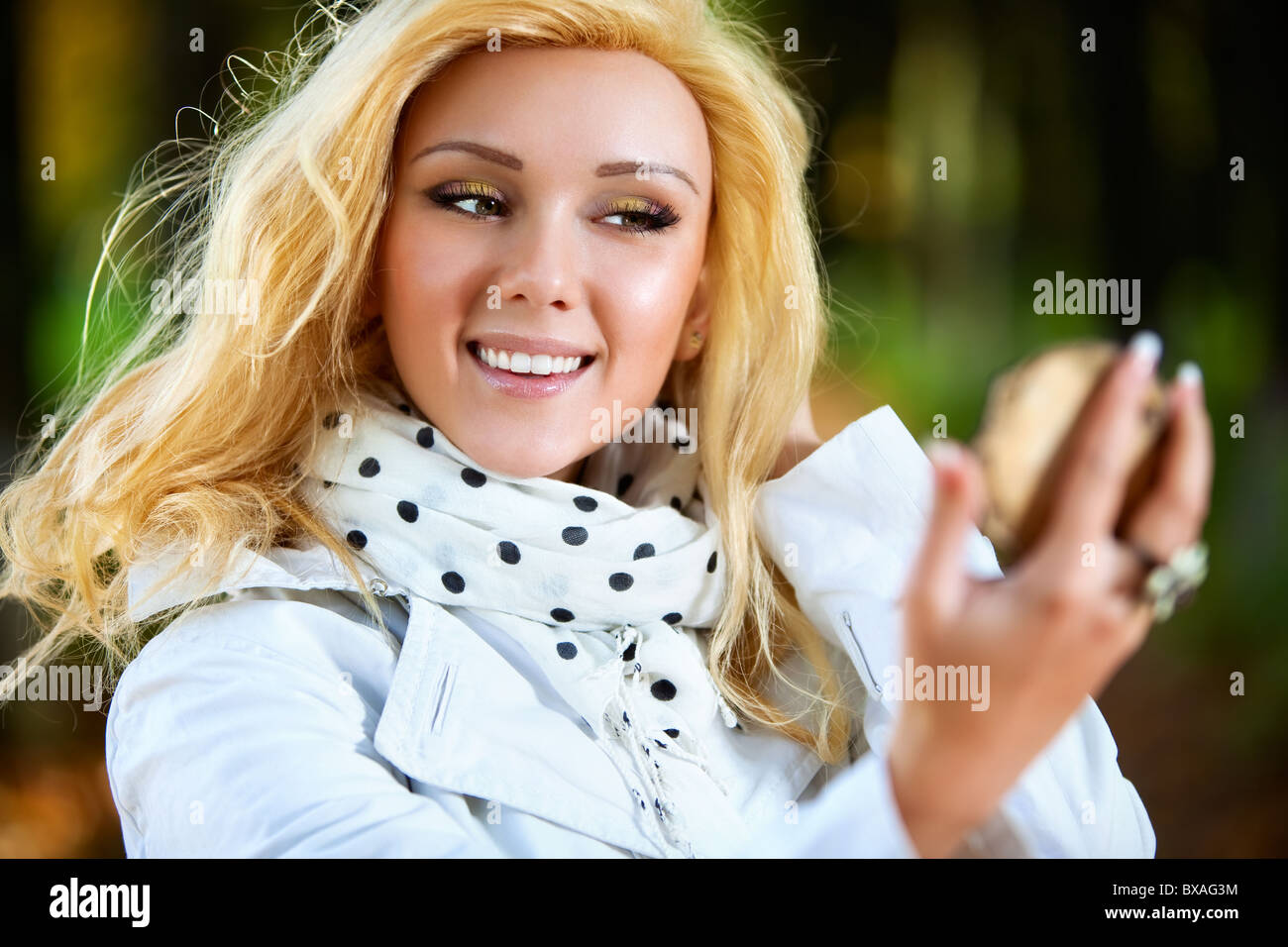 Young woman looking on mirror. Focus on face Stock Photo - Alamy