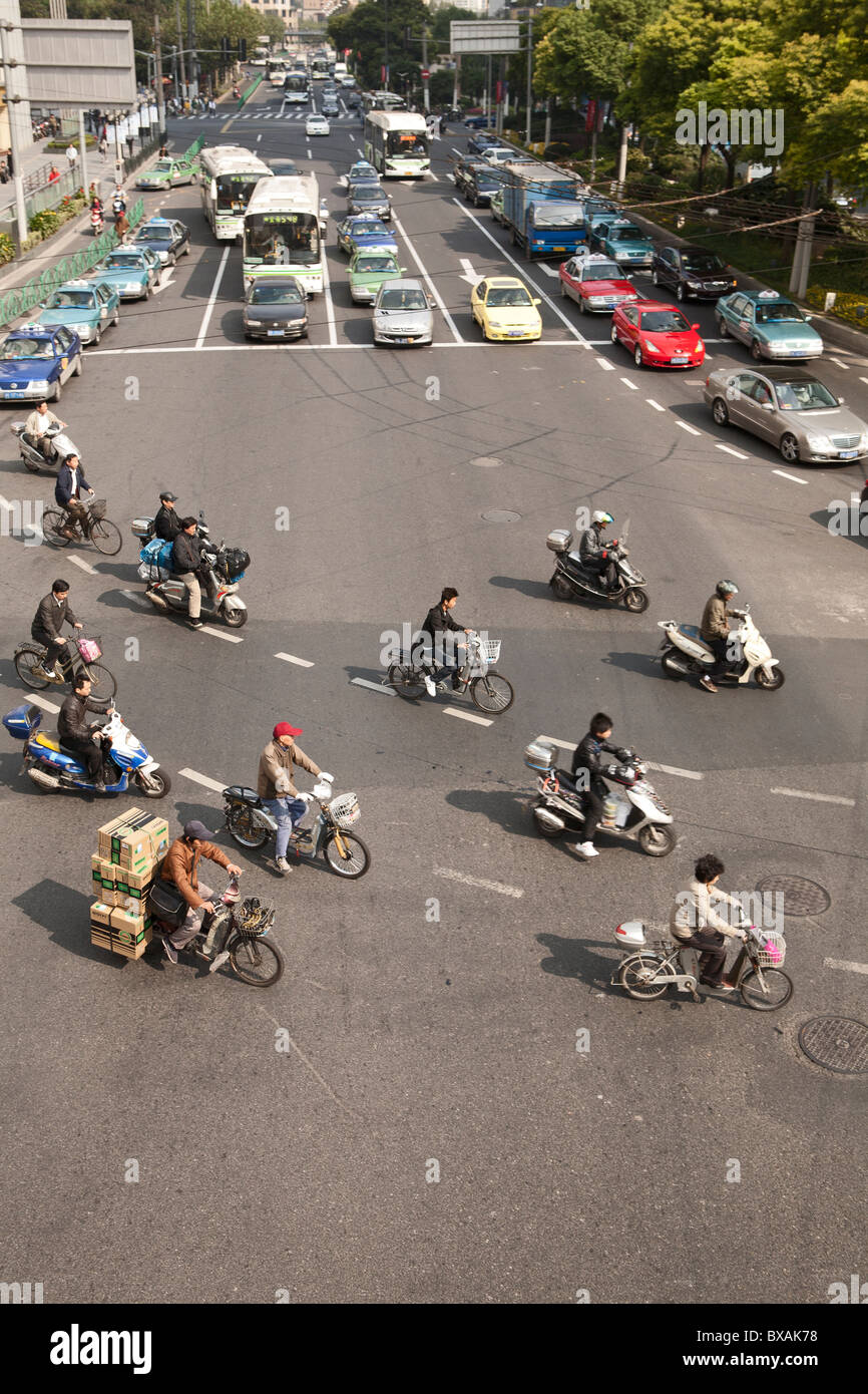 Group of motorbikes crossing road, Zhaojiabang Road, Shanghai, China ...