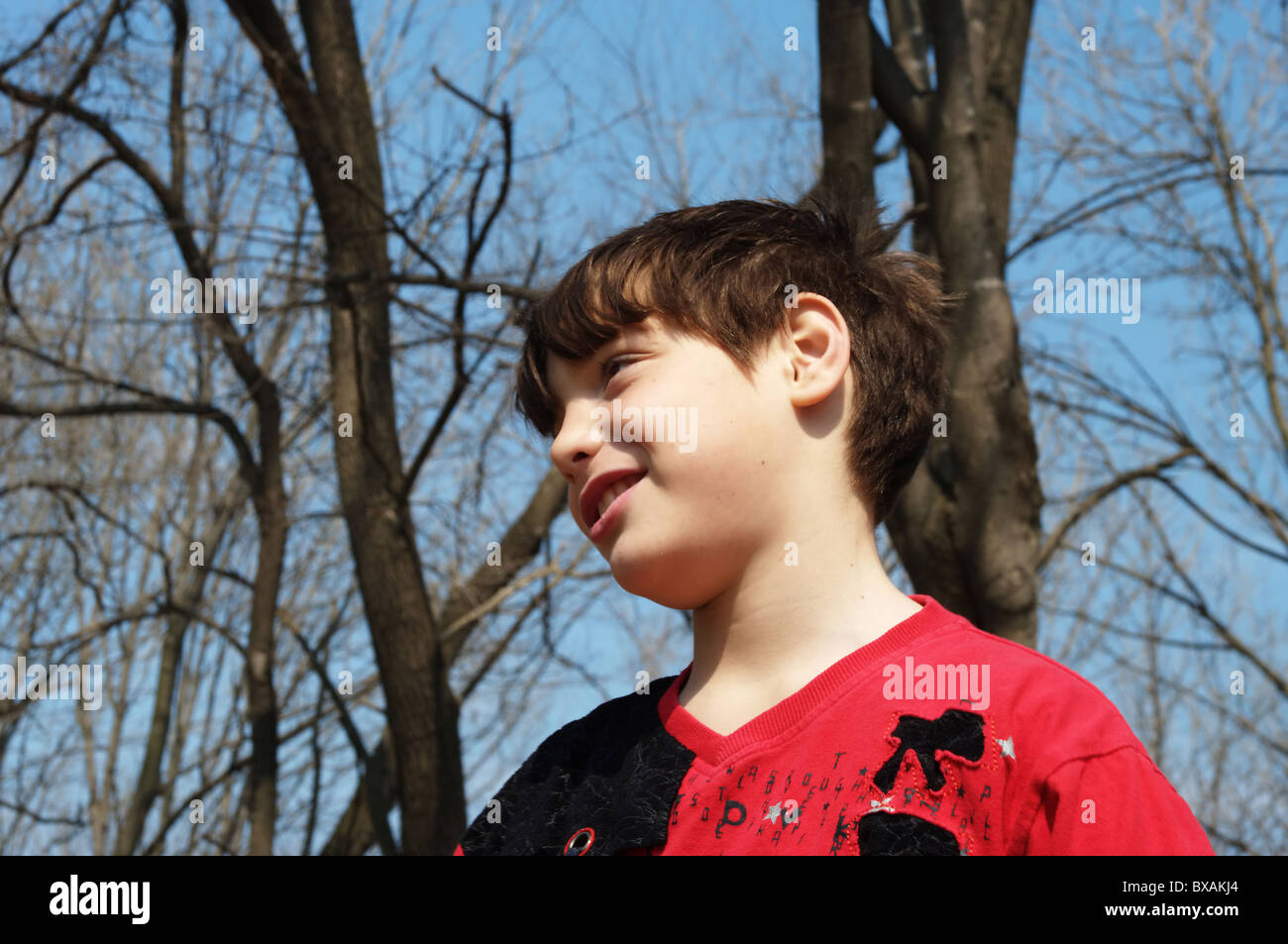 The boy in the spring in the open air Stock Photo - Alamy