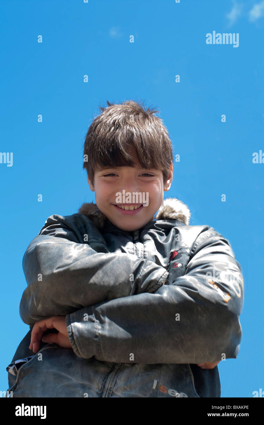 The boy against the dark blue sky Stock Photo - Alamy