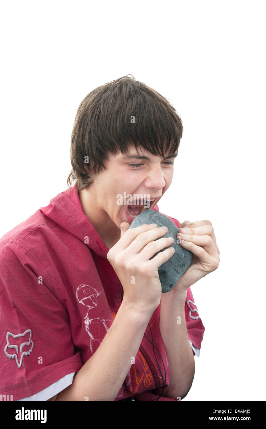 The teenager a biting stone Stock Photo - Alamy
