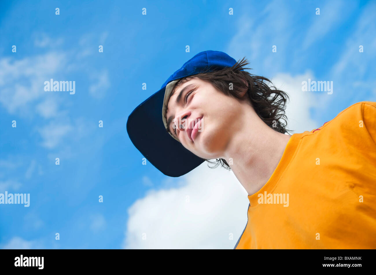 The young man against the sky looking afar Stock Photo - Alamy