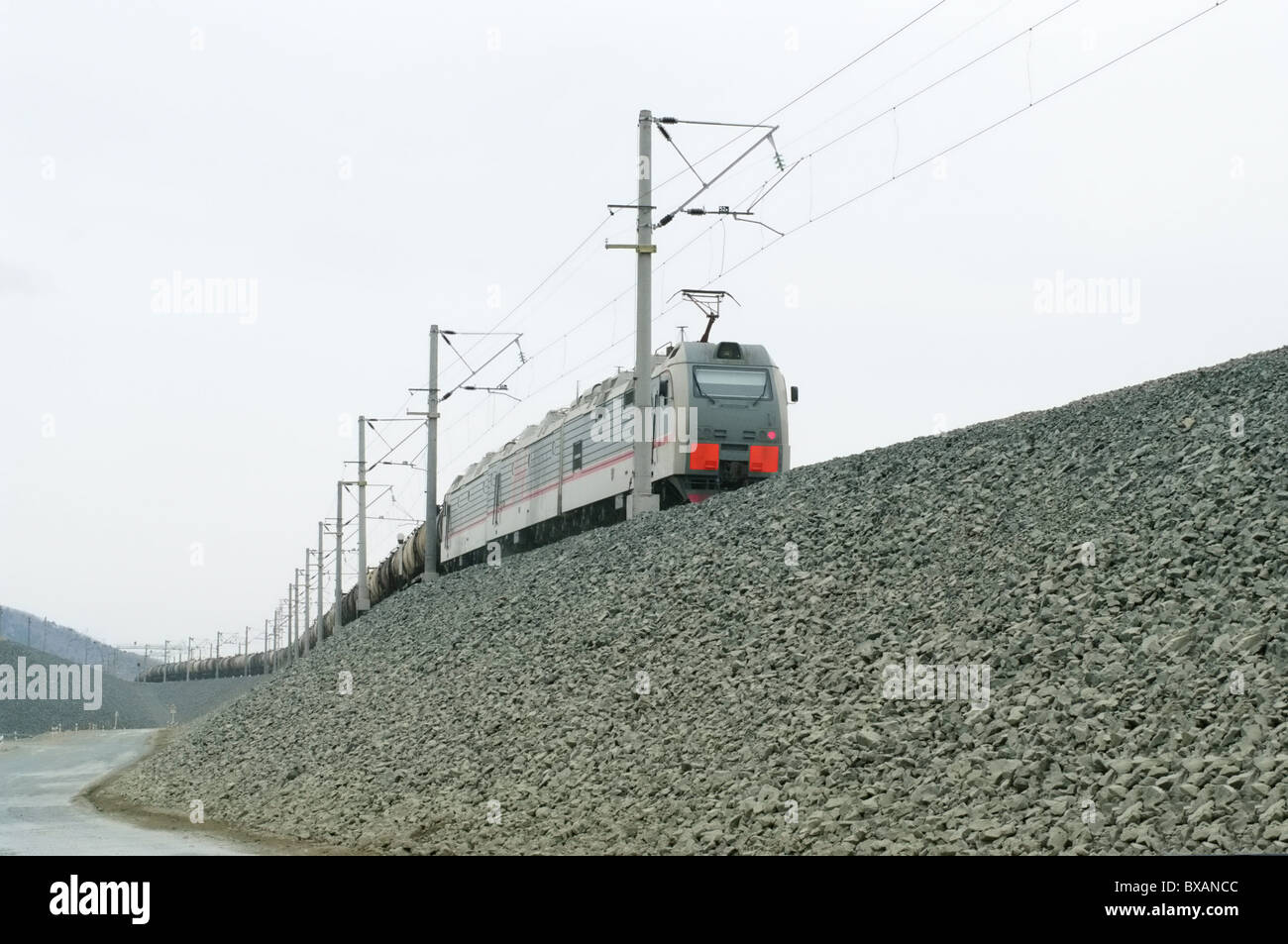 Electric locomotive with cars Stock Photo - Alamy