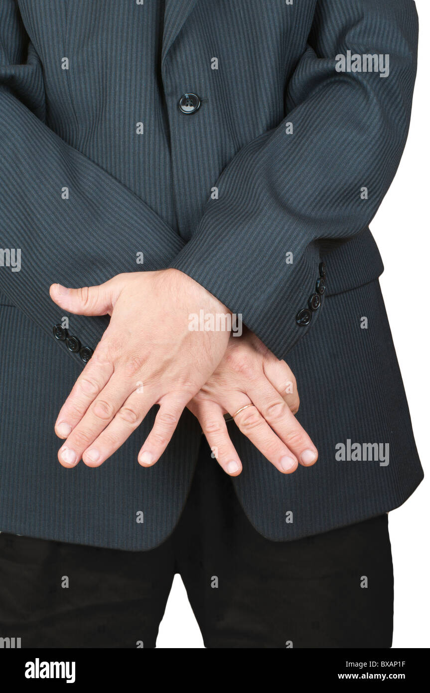 The man in a suit with the crossed of hands on a white background Stock ...