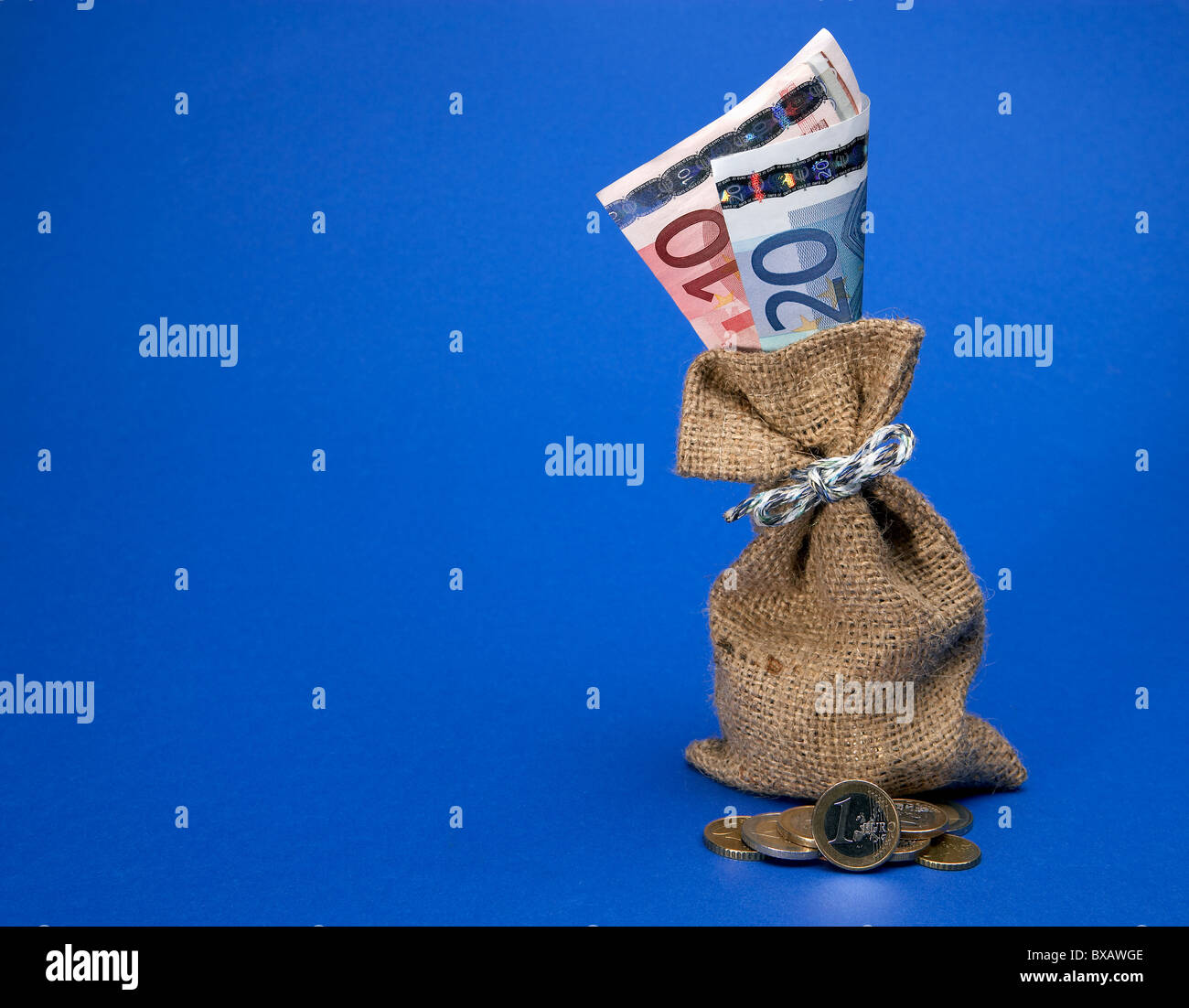 Euro bills and coins with a money bag hi-res stock photography and ...