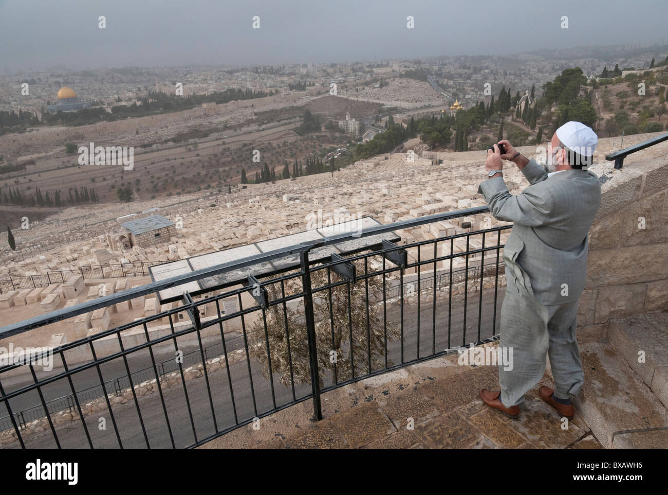 muslim tourist taking a picture of the Old City from the viewpoint at ...
