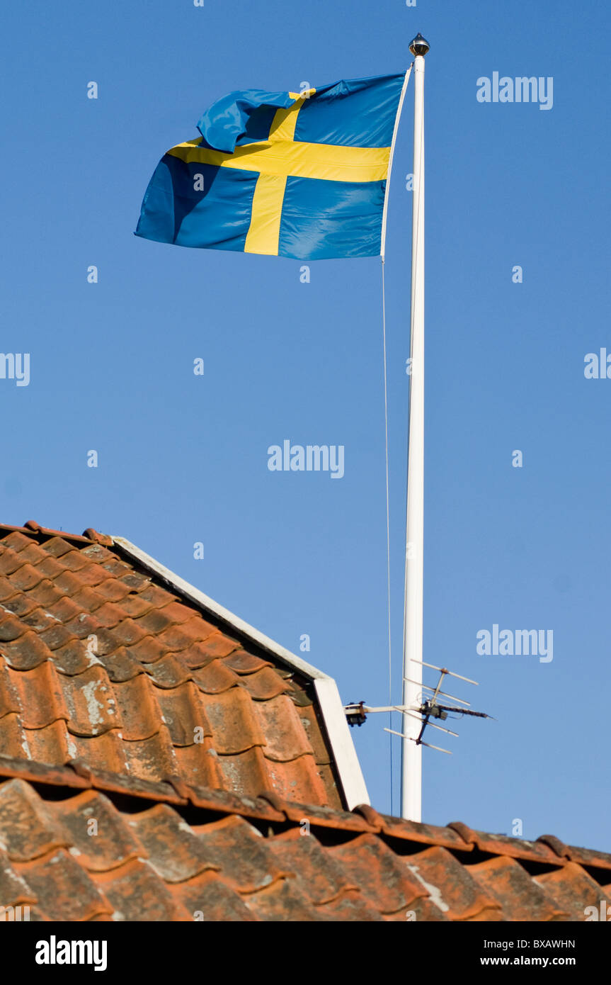 Swedish flag on roof Stock Photo - Alamy