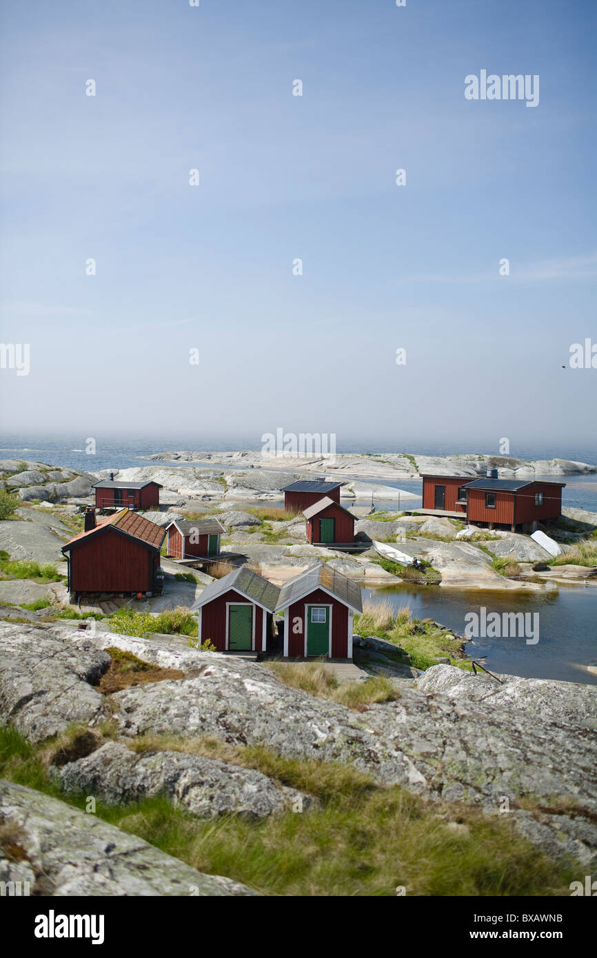 Cottages on rock by sea Stock Photo - Alamy