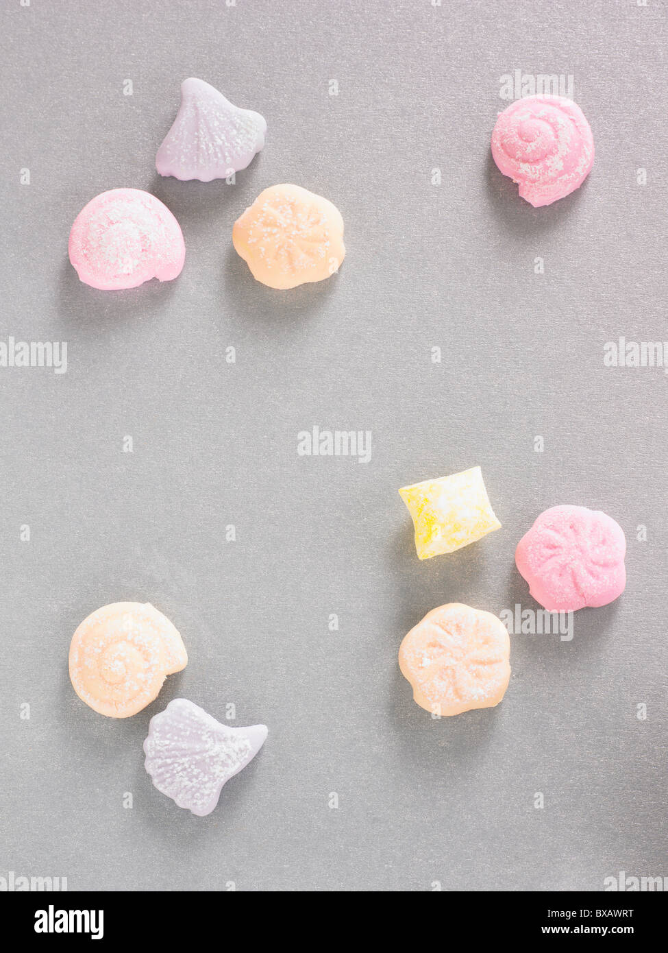 Candy sweet against grey background, close-up Stock Photo - Alamy